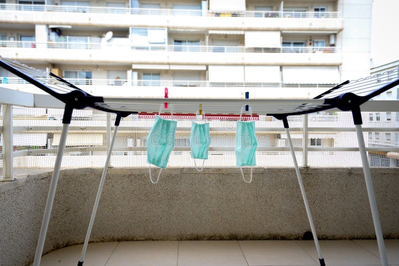 Face Masks Drying on a Clothes Rack. New Normal Concept Stock Photo ...