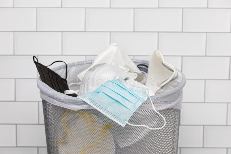 Face masks in garbage can. stock photo. Image of copy - 241328672