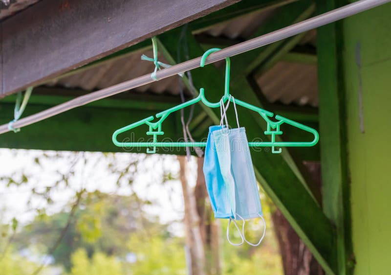 Face Masks Hanging for Reuse with Sky Background Include of Medical ...