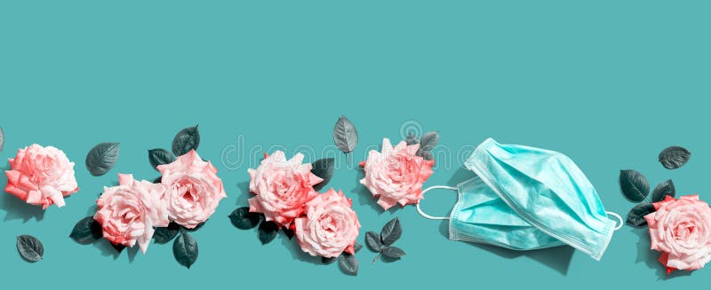 Face Masks with Pink Roses Overhead View Stock Photo - Image of ...