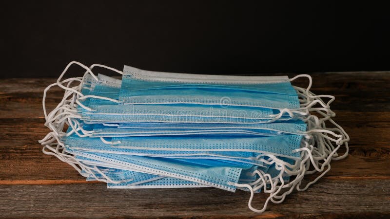 Face Masks Stack on Rustic Wooden Boards Stock Photo - Image of closeup ...