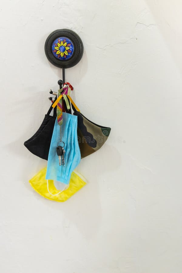 Face Masks of Various Types Hanging with a Bunch of Keys Stock Image ...