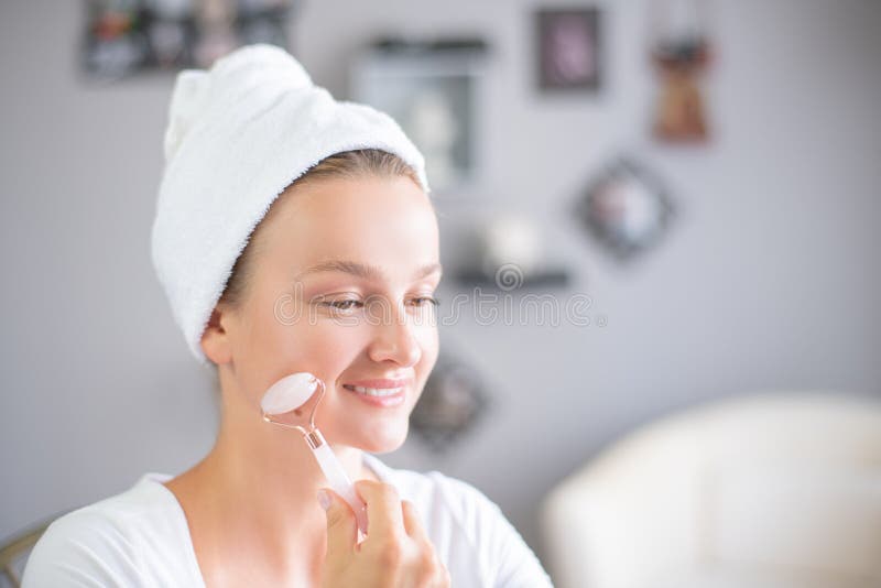 Face Massage Beautiful Woman Is Getting Massage Face Using Jade Facial