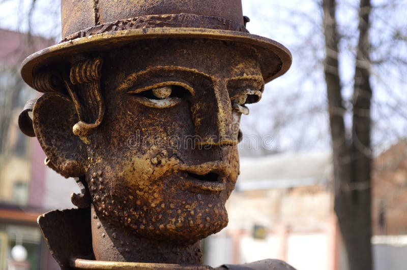 Face Of An Old Rusty Statue With Iron Violin Stock Image - Image of ...