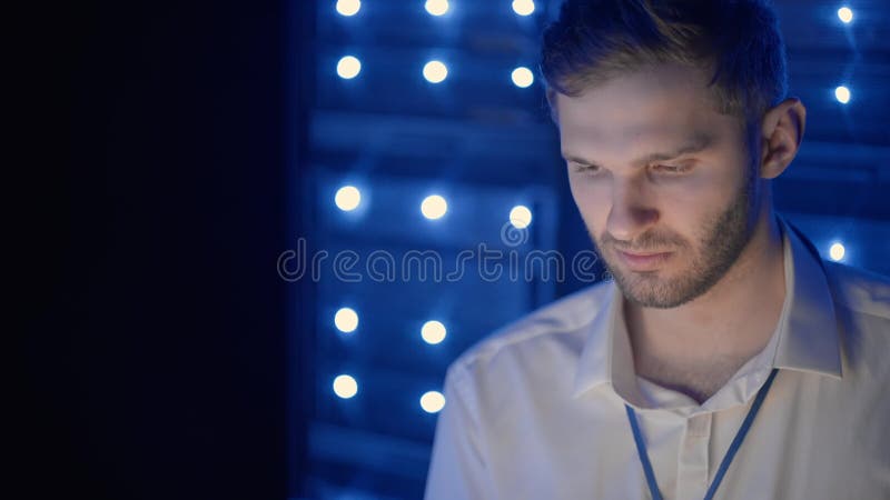 Face Portrait of Man Working in Server Room with Laptop. Technician ... Face Portrait of Man Working in Server Room with Laptop. Technician ...