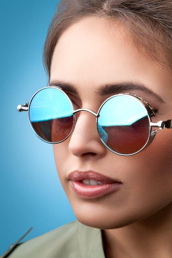 Face Portrait Of Young Beautiful Woman In Round Sunglasses Smiling