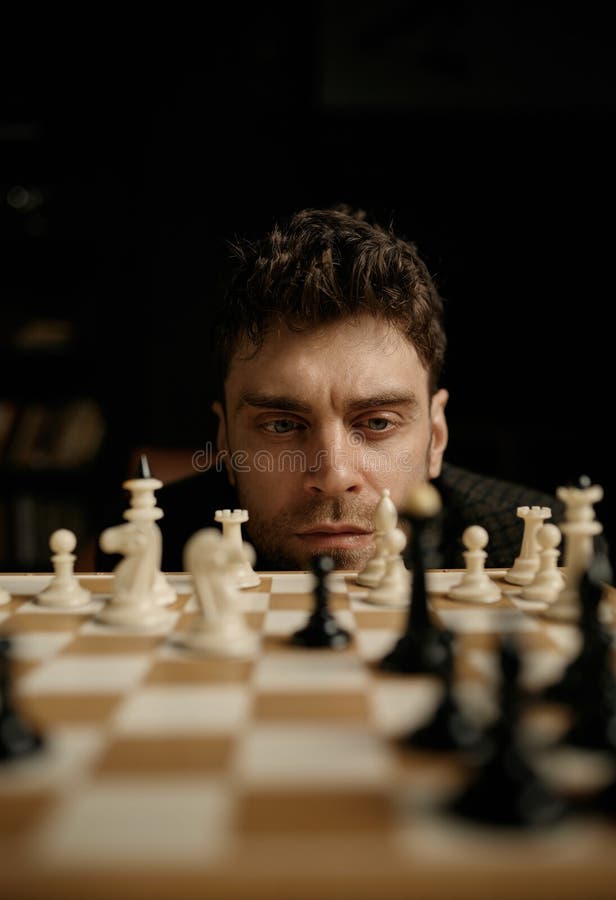 Face Portrait of Young Man Player Considering Chess Piece Position on ...