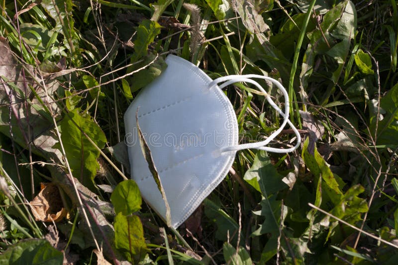 Face Mask Drop on Ground Grass Floor in Forest, Save the Nature ...