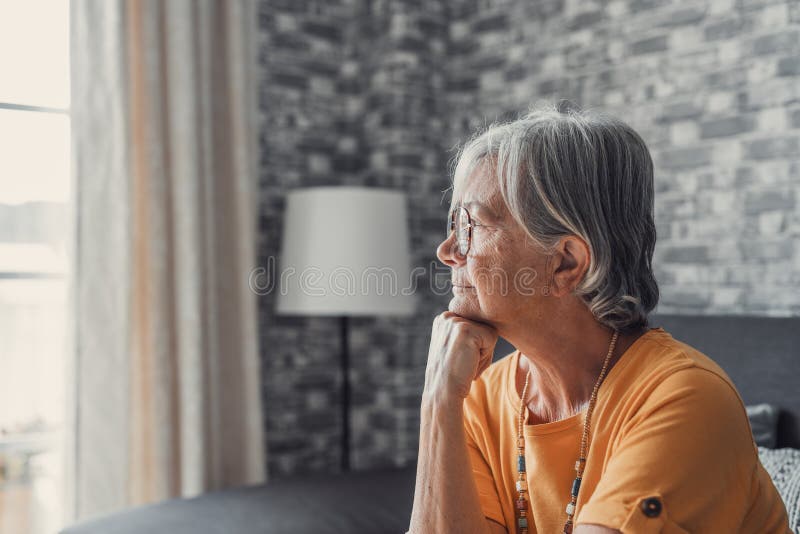Face Of Senior Caucasian Hoary Woman Looking Away Deep In Sad Thoughts
