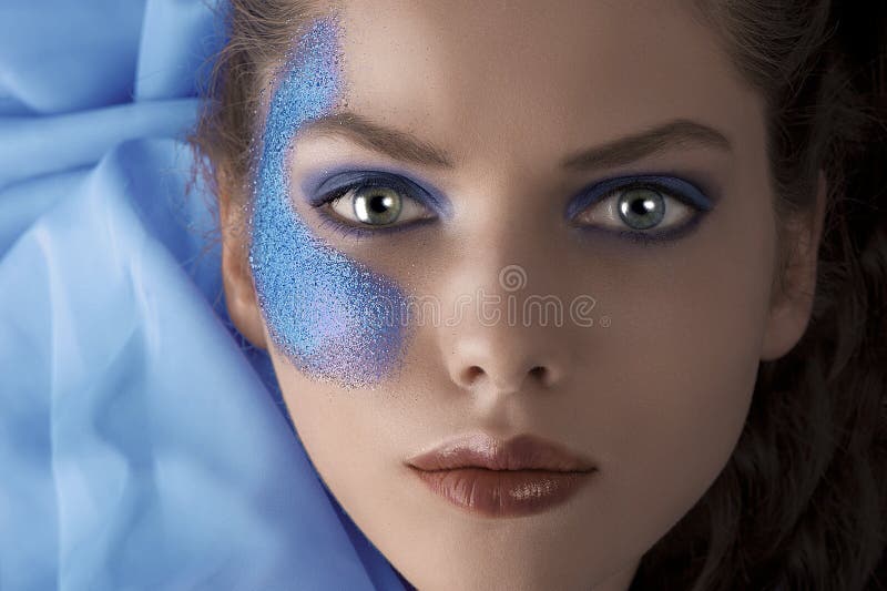 Face Shot of a Laying Model with Blue Glitter Stock Image - Image of ...