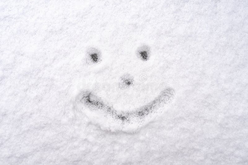 A Face with a Smile is Drawn on White Snow in Winter Stock Photo ...