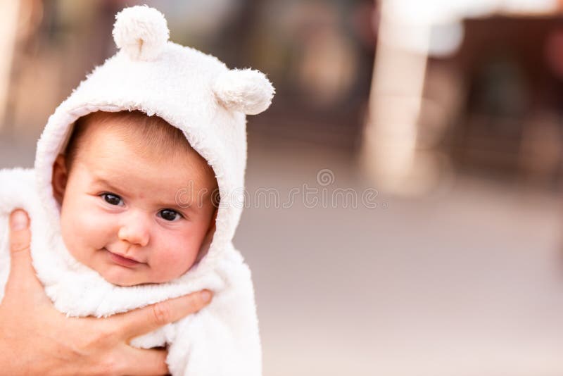 Face of Smiling Baby Girl Dressed in a Cap with Ears Stock Photo ...