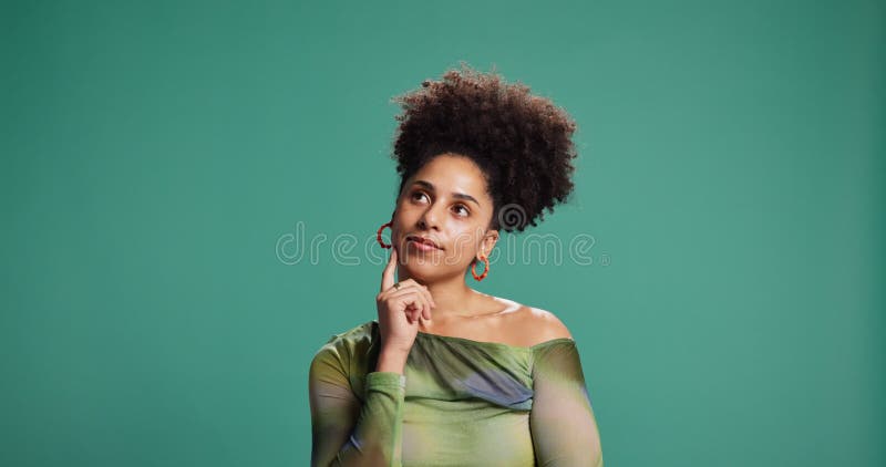 Face, Solution and Thinking with Black Woman on Green Background for ...