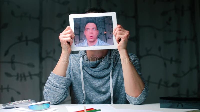 The Face of a Surprised Man on the Tablet Screen. Stock Footage - Video ...