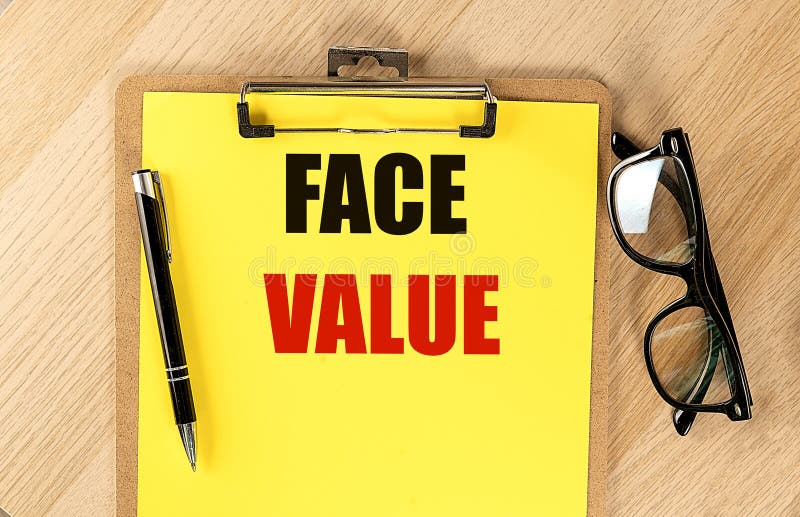 FACE VALUE Text on Yellow Paper on Clipboard with Pen and Glasses Stock ...