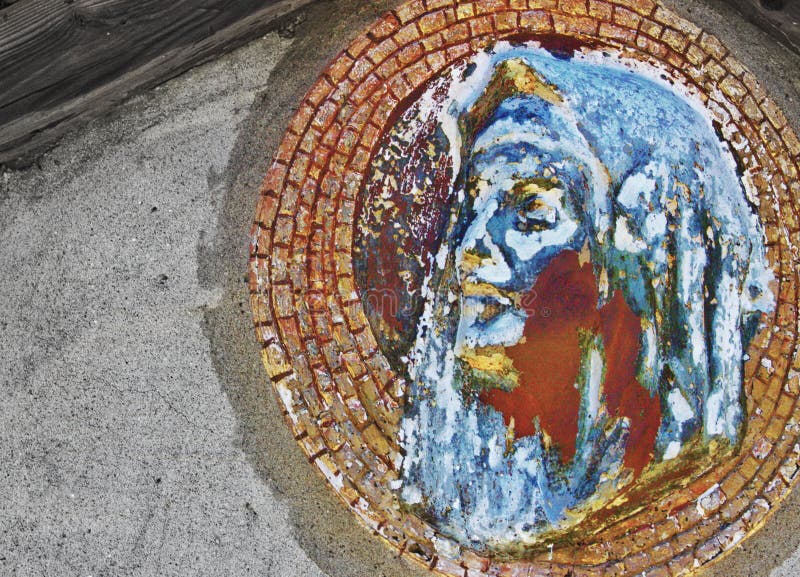 Face on a wall stock photo. Image of saint, brick, wall - 152766310