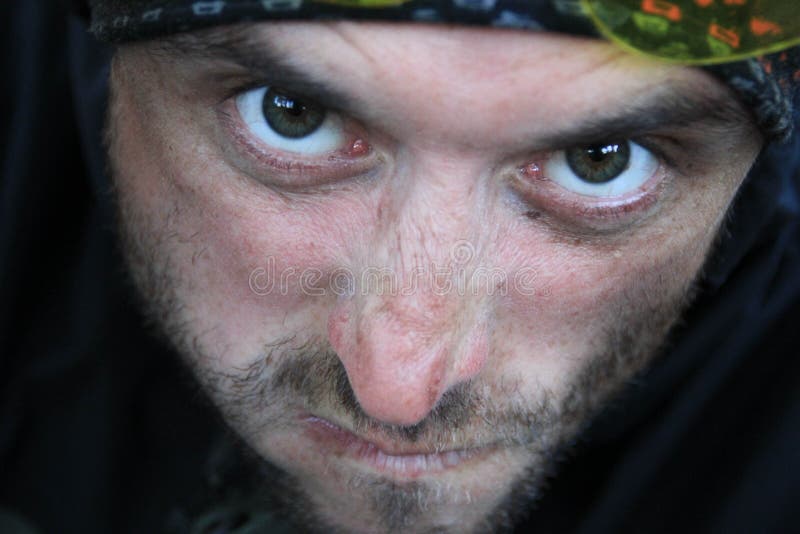 The Face of a White Young Man is Distorted by Anger and Aggression. he ...