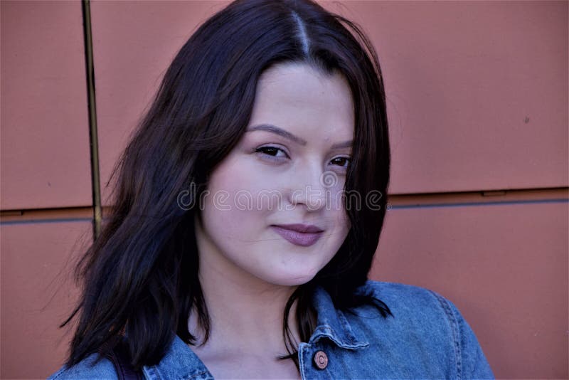 The Face of a Woman with a Slightly Raised Eyebrow Stock Photo - Image ...