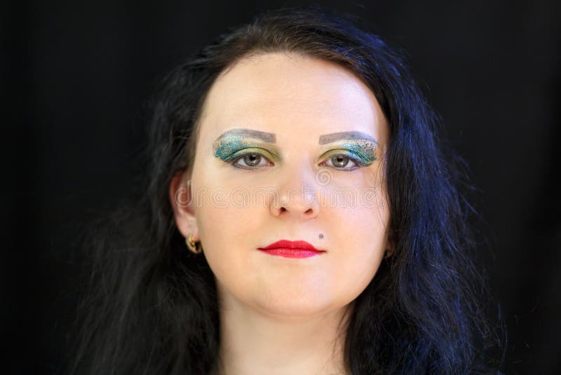 The Face of a Young Brunette with a Bright Make-up Glazed Shadows and ...