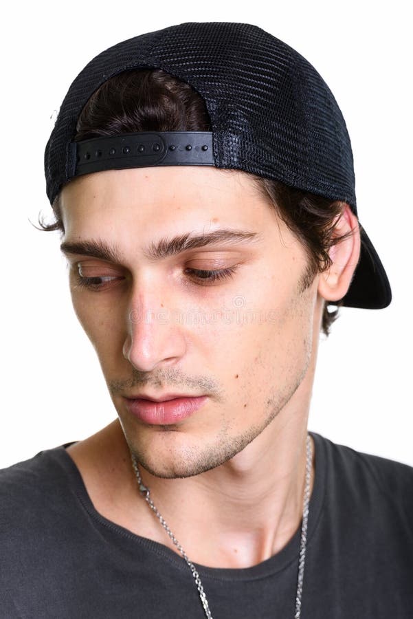 Face of Young Handsome Man Wearing Snapback while Looking Down Stock ...