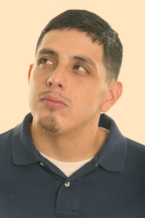 Face of Young Hispanic Man Thinking while Looking Up Stock Photo ...