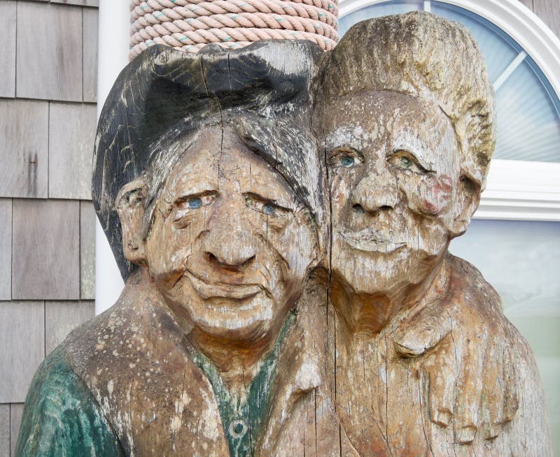 Faces, carved from wood stock image. Image of kerchief - 40795041