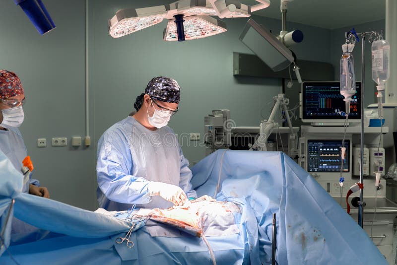 The Faces of Doctors Surgeons in Masks are a Big Plan, an Operating ...