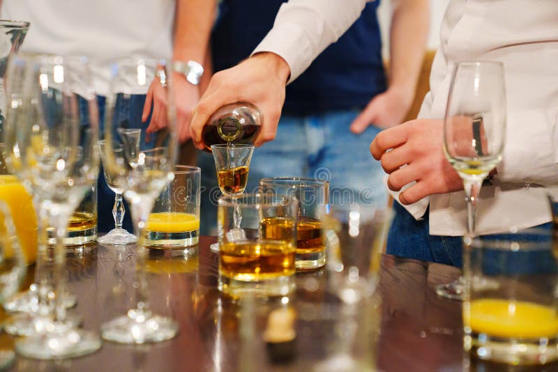 Without Faces. a Man Pours Cognac in a Stack Stock Image - Image of ...