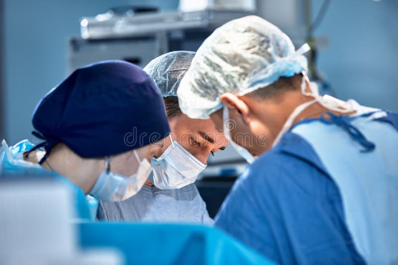 Faces of Surgeons in the Operating Room during the Operation, Modern ...