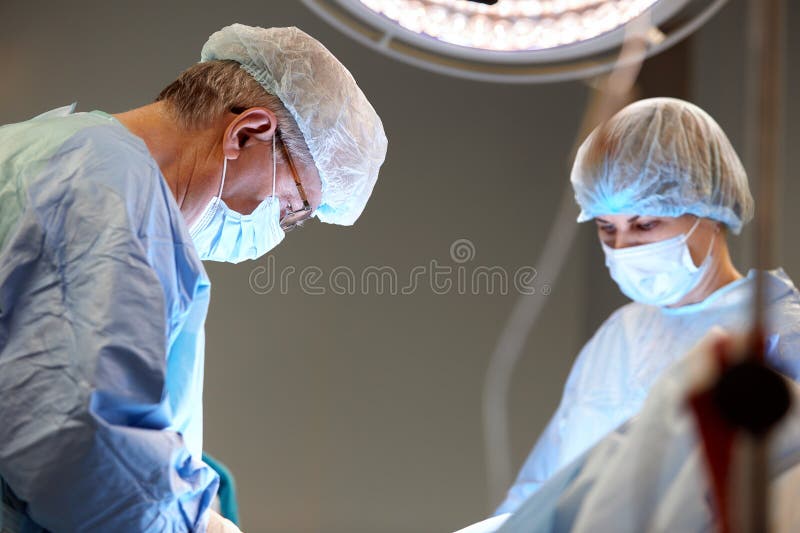 Faces of Surgeons in the Operating Room during the Operation, Modern ...