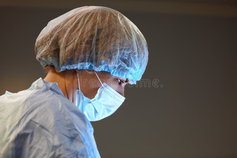 Faces of Surgeons in the Operating Room during the Operation. Modern ...