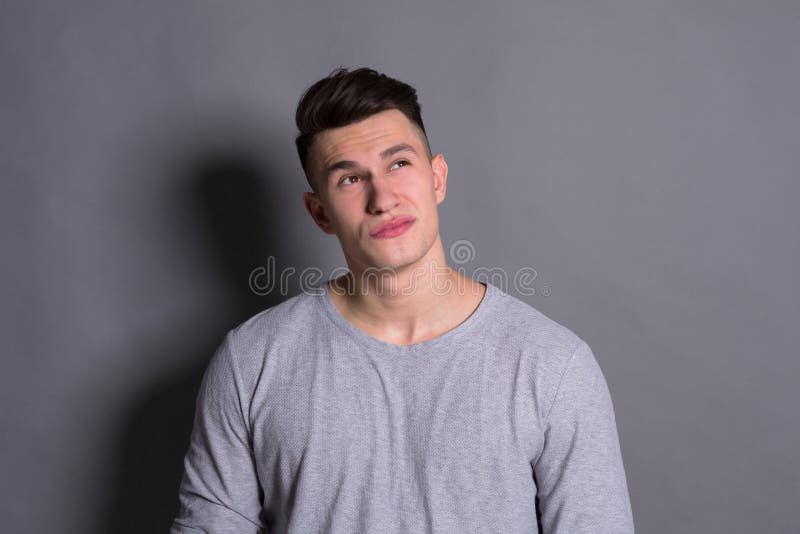 Facial Expression, Doubtful Man Looks Up Stock Photo - Image of camera ...