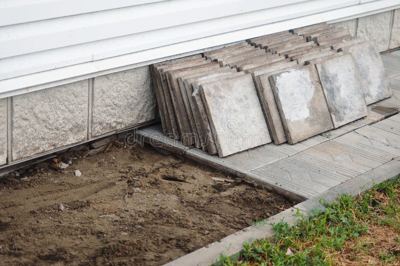 Facing Concrete Tiles Lie on Ground in Stack. Replacing Building ...