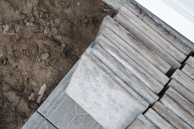 Facing Concrete Tiles Lie on Ground in Stack. Replacing Building ...