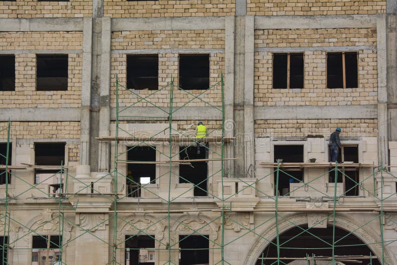 Workers on Building, Facing of the Building Editorial Stock Image ...