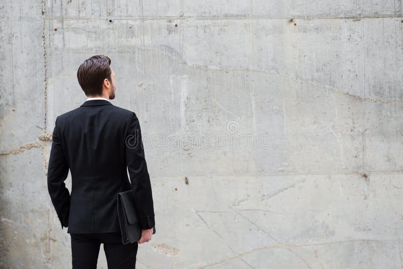 Facing a wall. stock image. Image of male, outdoors, formalwear - 51748311