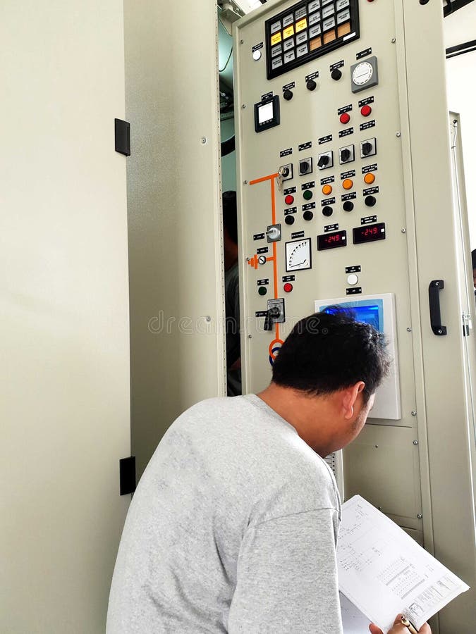 Electrical Engineer Rechecks Auto Voltage Regulator Setting before ...