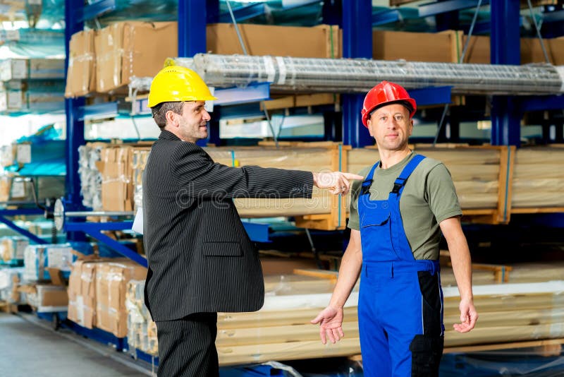 Boss Pointing at Worker in Factory Stock Image - Image of constructor ...