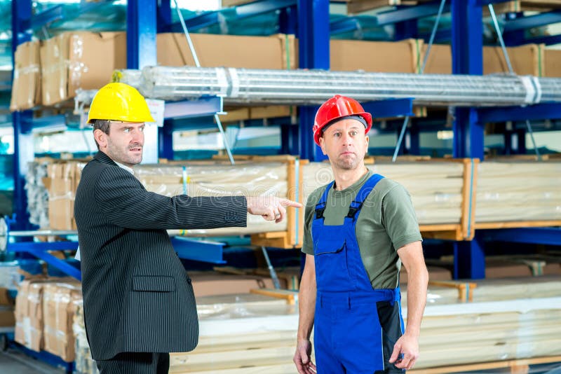 Boss Pointing at Worker in Factory Stock Photo - Image of constructor ...