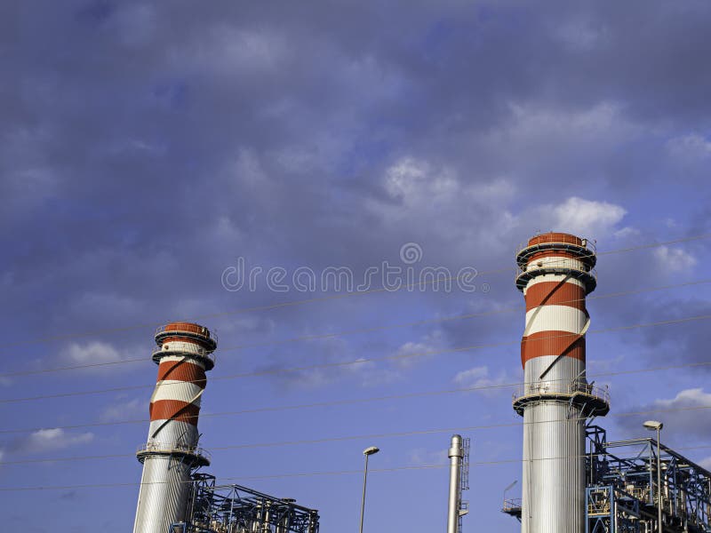 Factory chimney stacks stock image. Image of global, carbon - 80272019