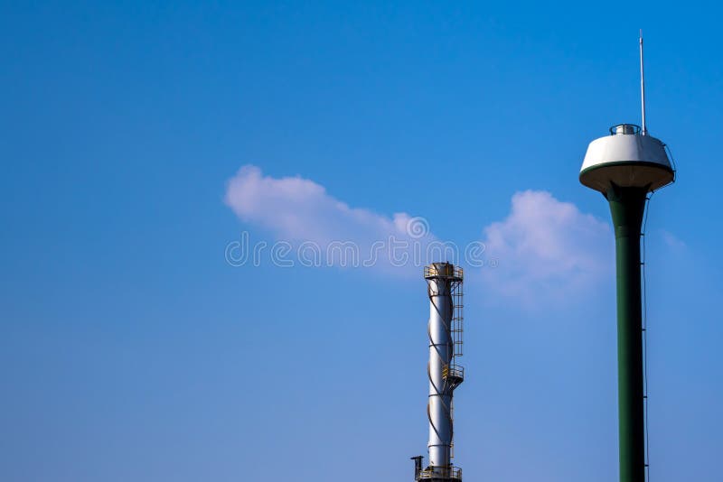 Factory Chimney and the Water Tower Tank on Blue Sky Stock Image ...