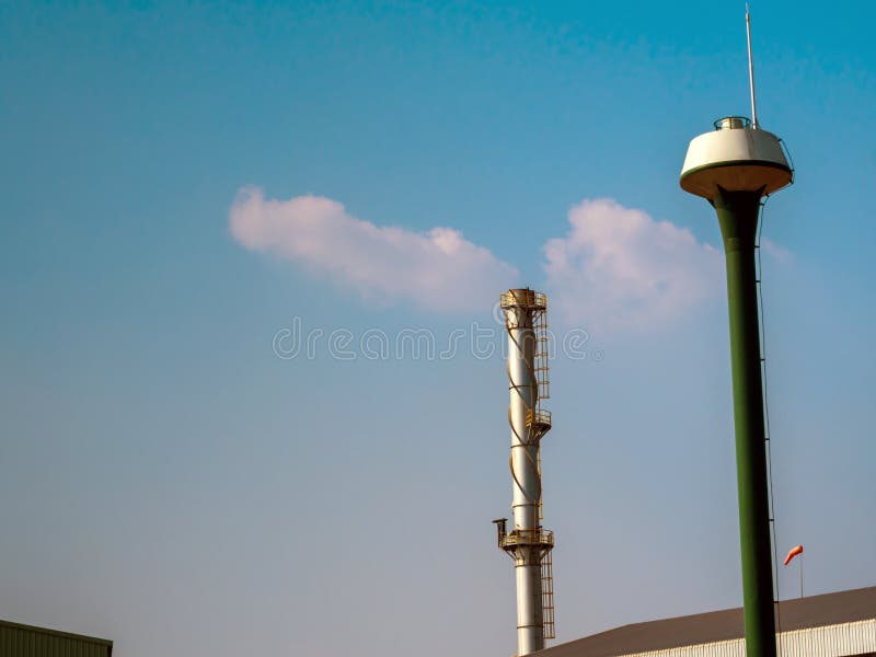 Factory Chimney and the Water Tower Tank on Blue Sky Stock Photo ...