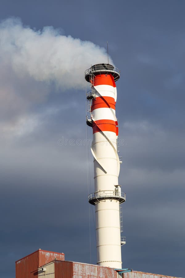 Factory Chimney and Abandoned Warehouse Against Blue Sky Stock Photo ...