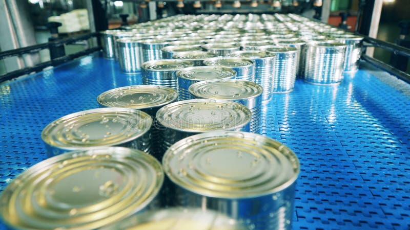 Factory Conveyor is Transporting Newly-sealed Tin Cans. Factory ... Factory Conveyor is Transporting Newly-sealed Tin Cans. Factory ...