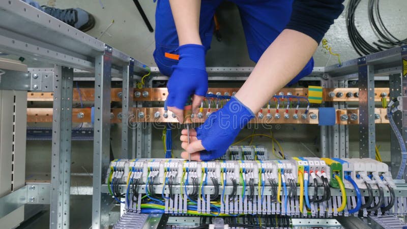 Factory Electrician Engineer Installing Cables with Screwdriver ...