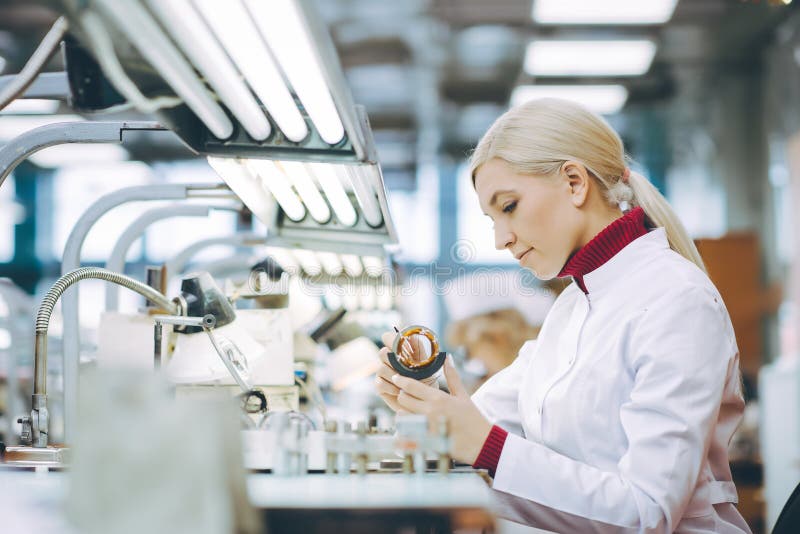Factory electronics worker stock image. Image of device - 107047955