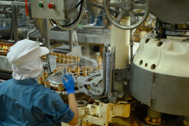 Factory Employee Wearing Protective Clothes Managing Canning Process in ...