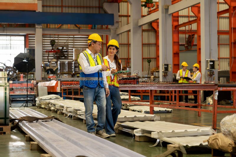 Factory Engineer with Assistant Using Inspect Factory. Pano ...