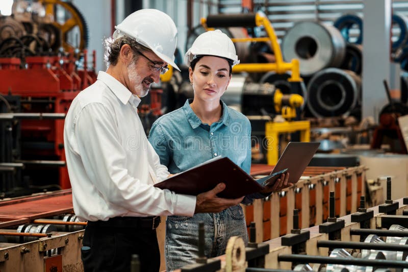 Factory Engineer with Assistant Using Laptop Inspect Factory. Exemplifying Stock Image - Image ...