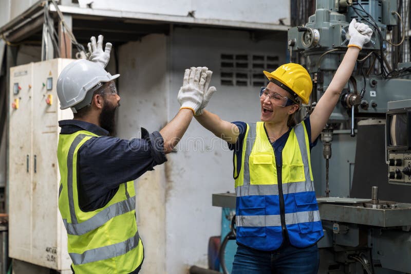 Factory Engineer Operating Machines in Industry Factory. Workers and ...